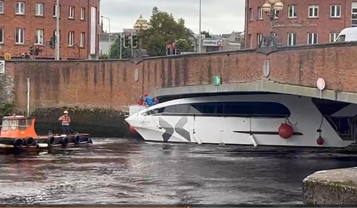 WATCH: Boat has lucky escape after getting stuck under Limerick bridge ...