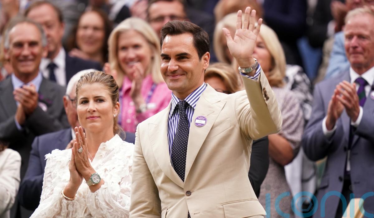 Roger Federer welcomed back to Centre Court for first time since his ...