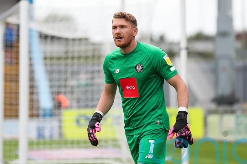Inspired goalkeeper Mark Oxley secures point for Harrogate at Grimsby ...